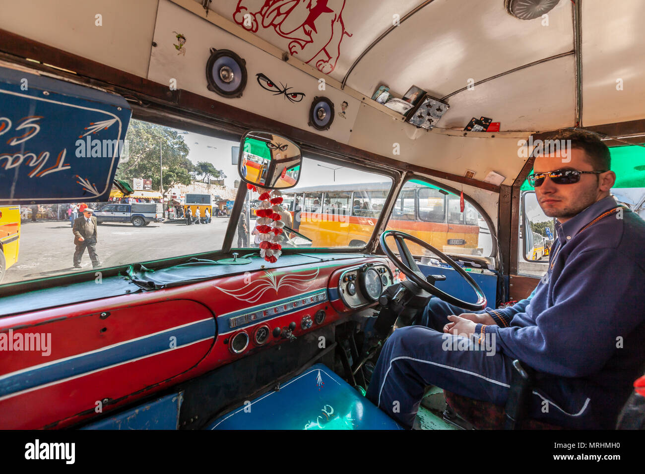 Maltese bus driver in cockpit of historic and individually decorated ...