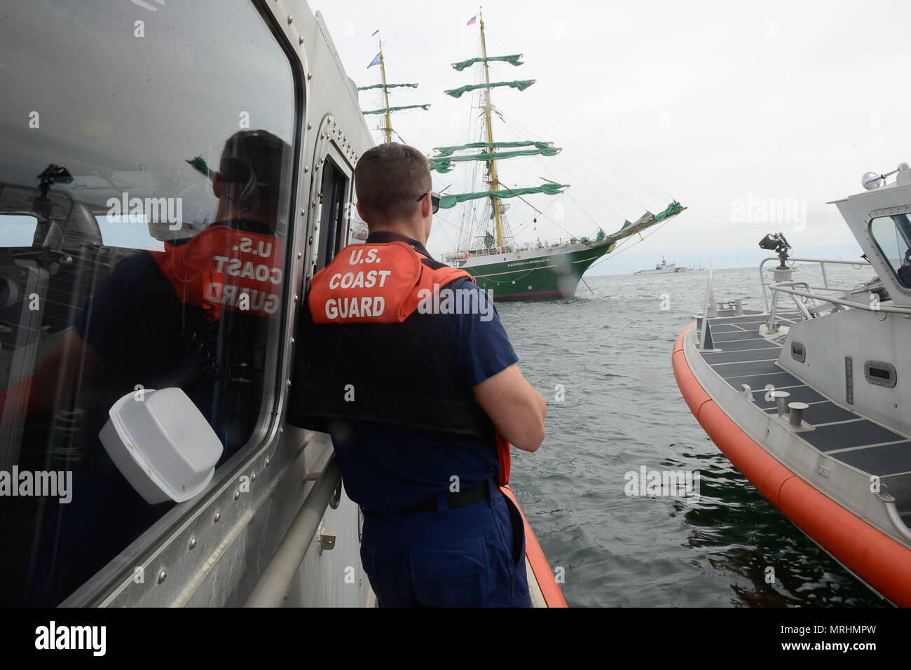 Two U.S Coast Guard 45-foot response boat crews approach the German ...