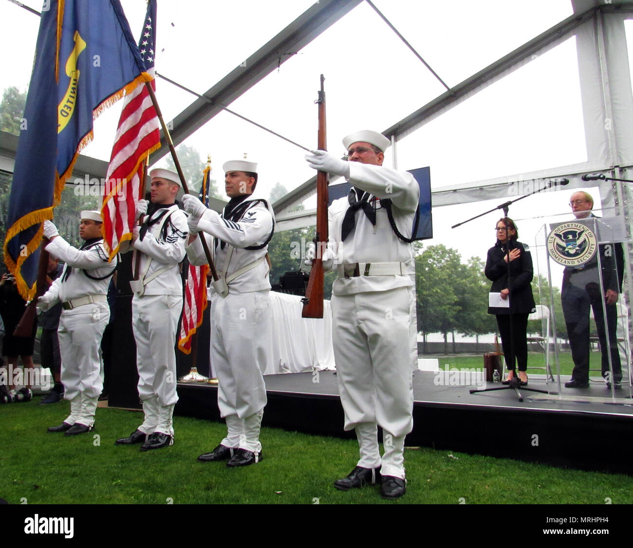 A U.S. Navy color guard presents the national colors during the playing ...