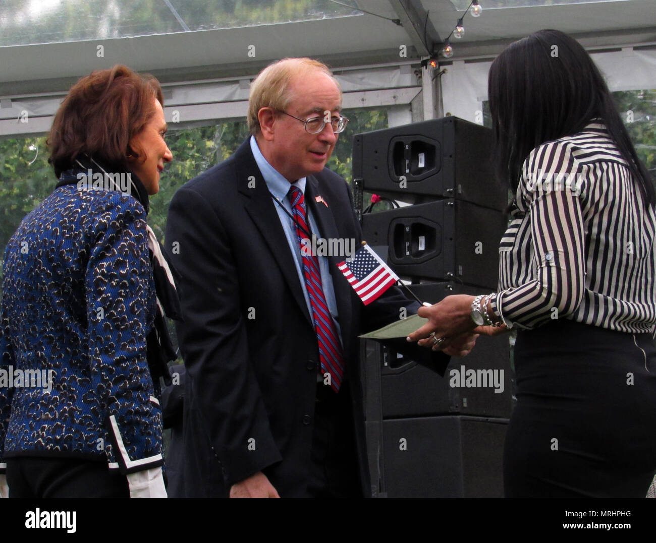 A newly naturalized citizen of the United States receives her ...