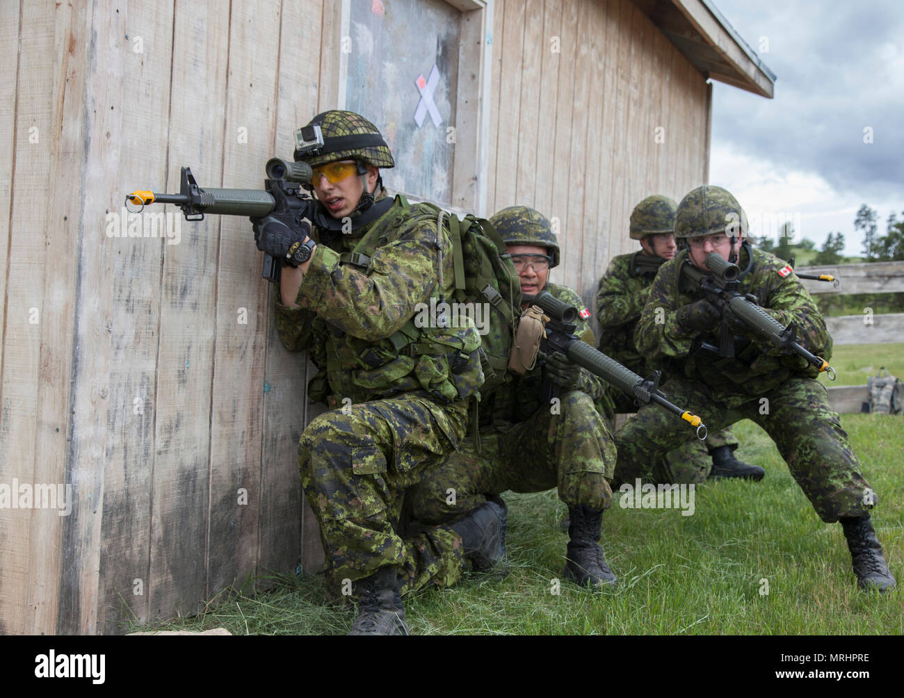 Soldiers of the 3rd Canadian Division, Canadian Army prepares to scan ...