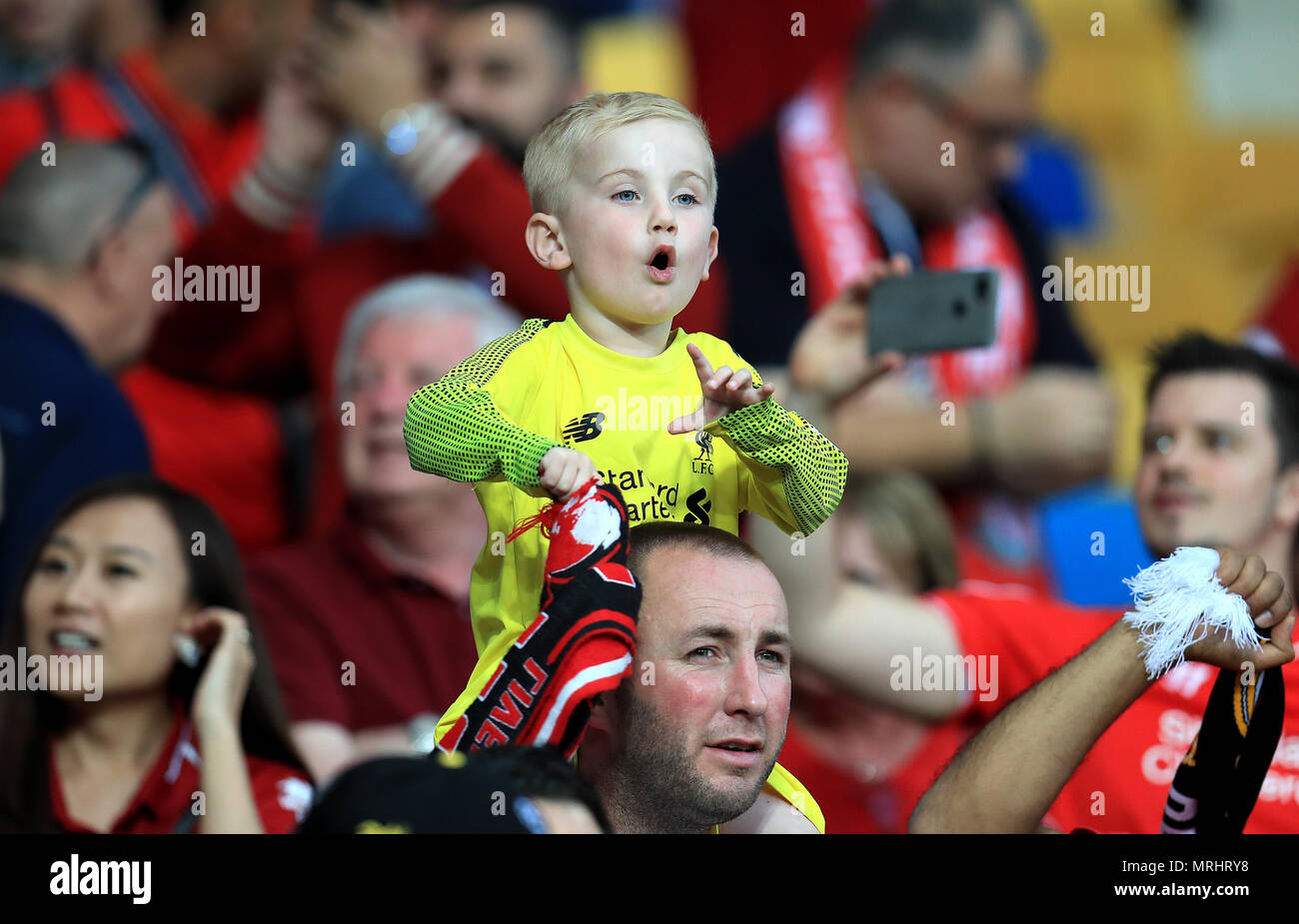 A young Liverpool fan shows his support in the stands prior to the UEFA ...