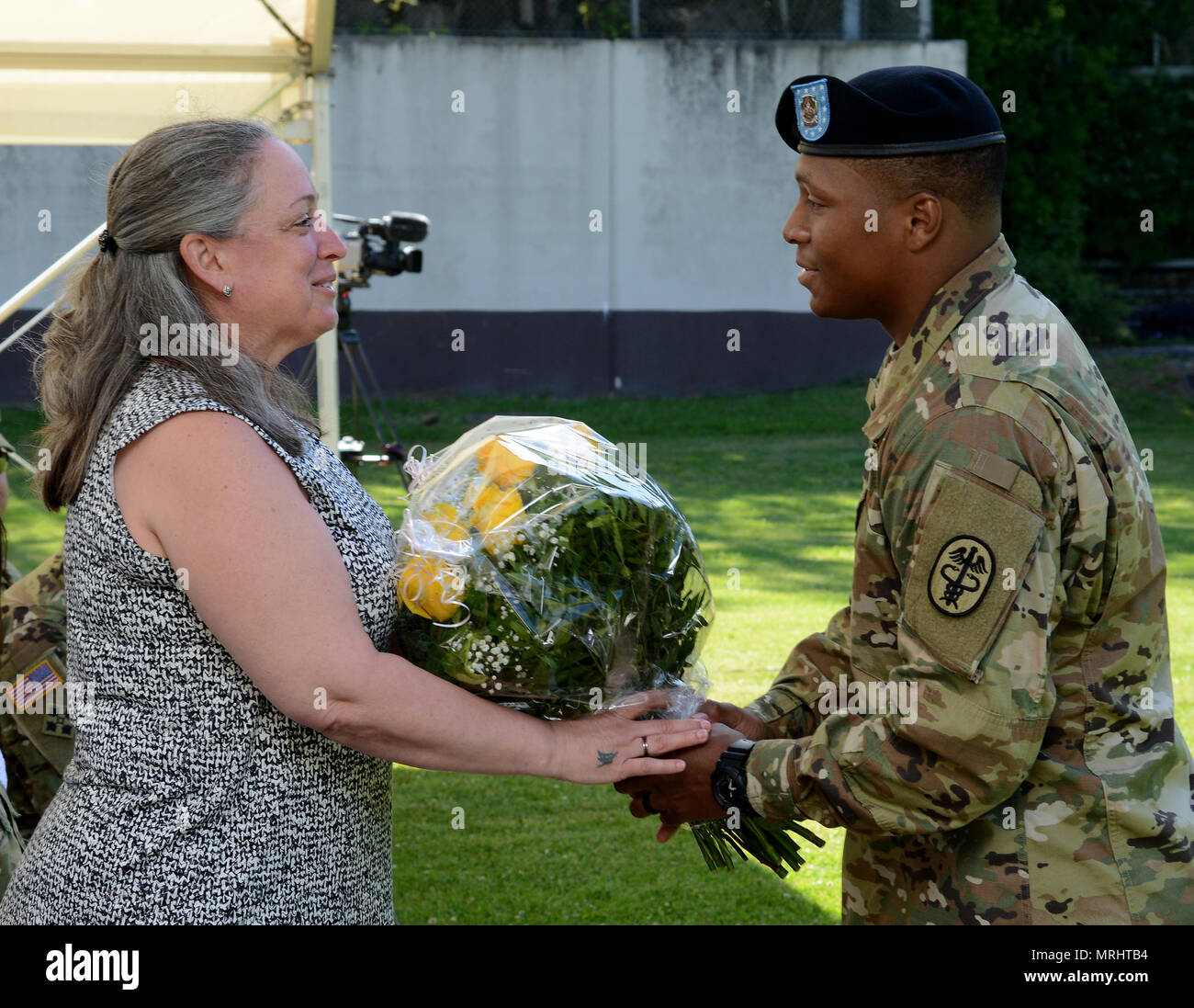 Yellow roses are presented to Command Sgt. Maj. Joseph Cecil’s ...