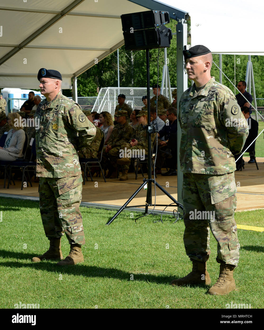 The incoming and outgoing command sergeants major stand and wait for ...