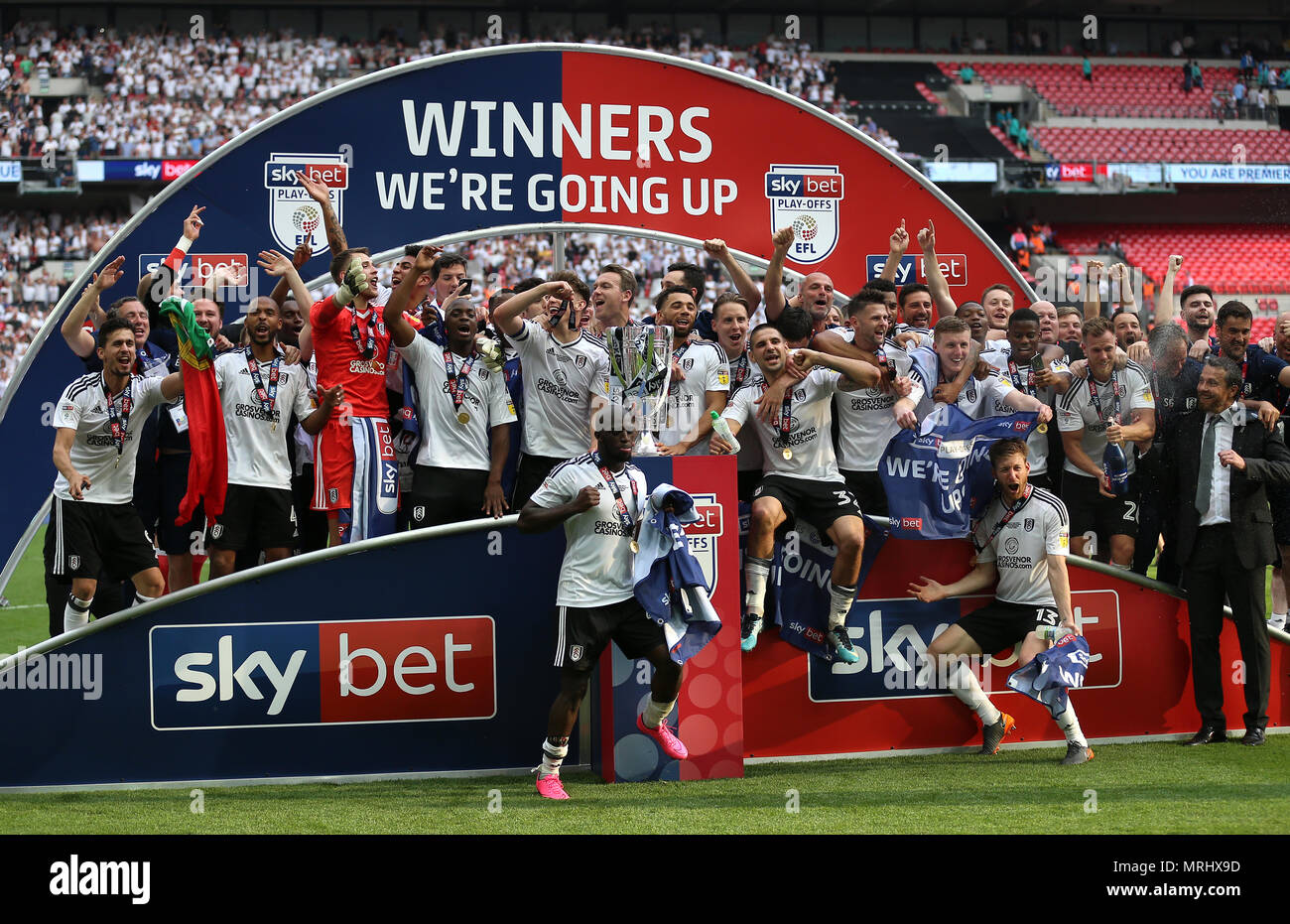 Fulham players celebrate promotion after the final whistle during the ...