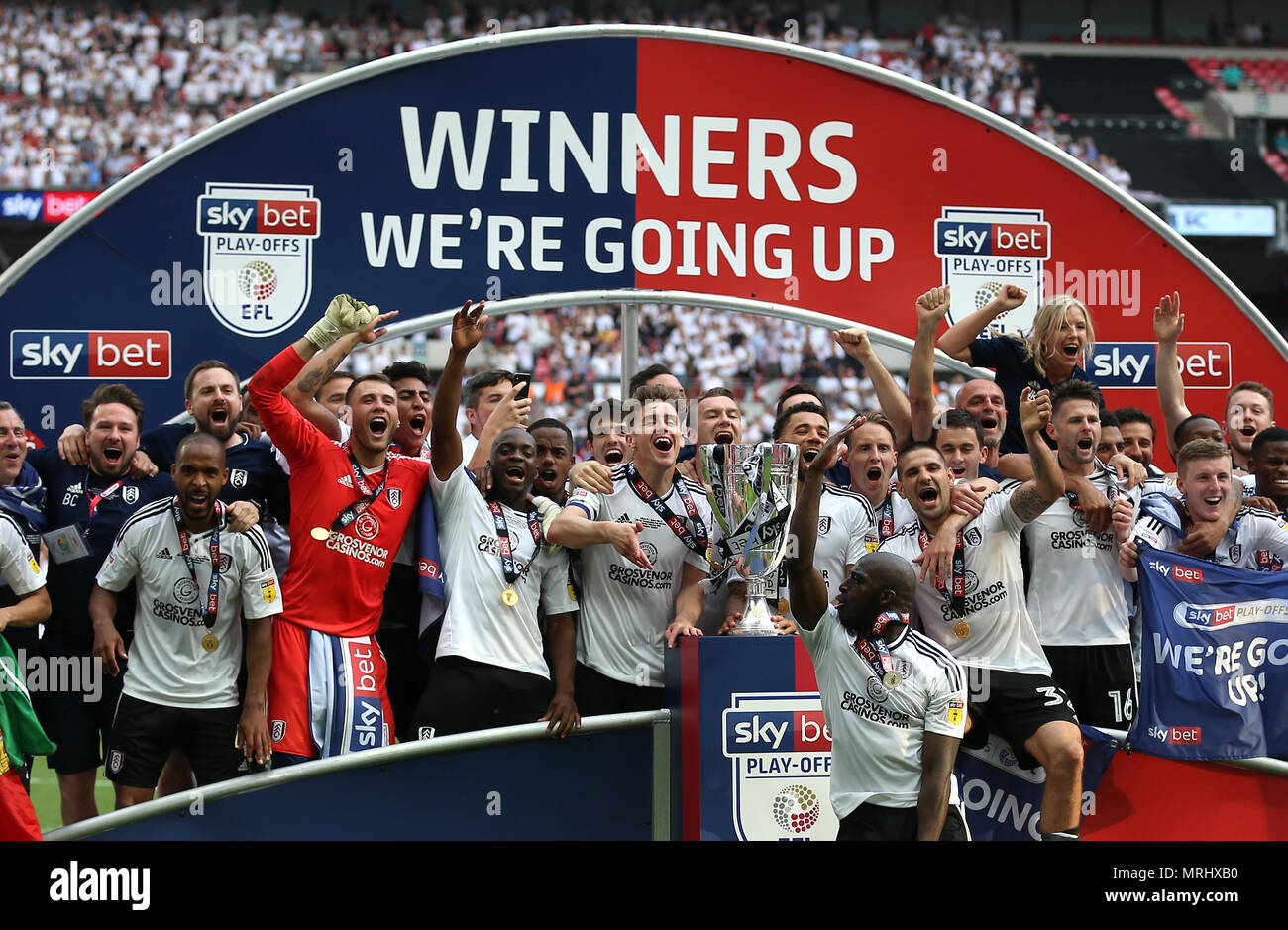 Fulham players celebrate promotion after the final whistle during the ...