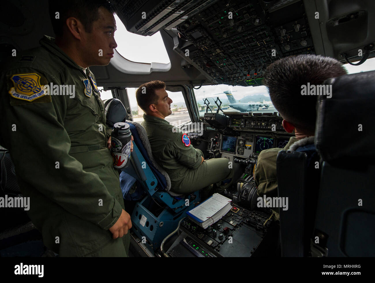 Col. Charles Velino, 15th Operations Group commander, Maj. Justin ...