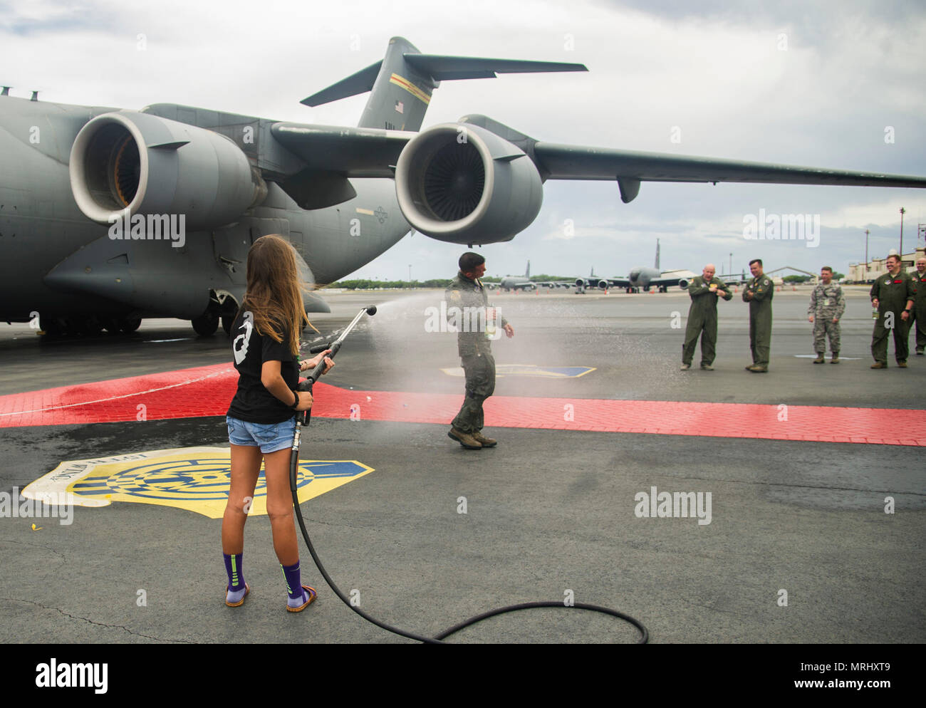 Friends and family members spray Col. Charles Velino, 15th Operations ...