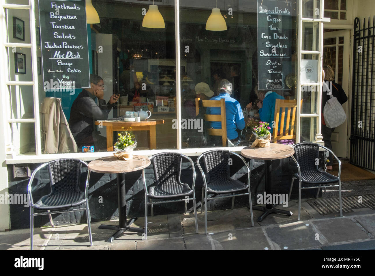 Customers in a cafe in Canterbury, Kent, England, UK Stock Photo - Alamy