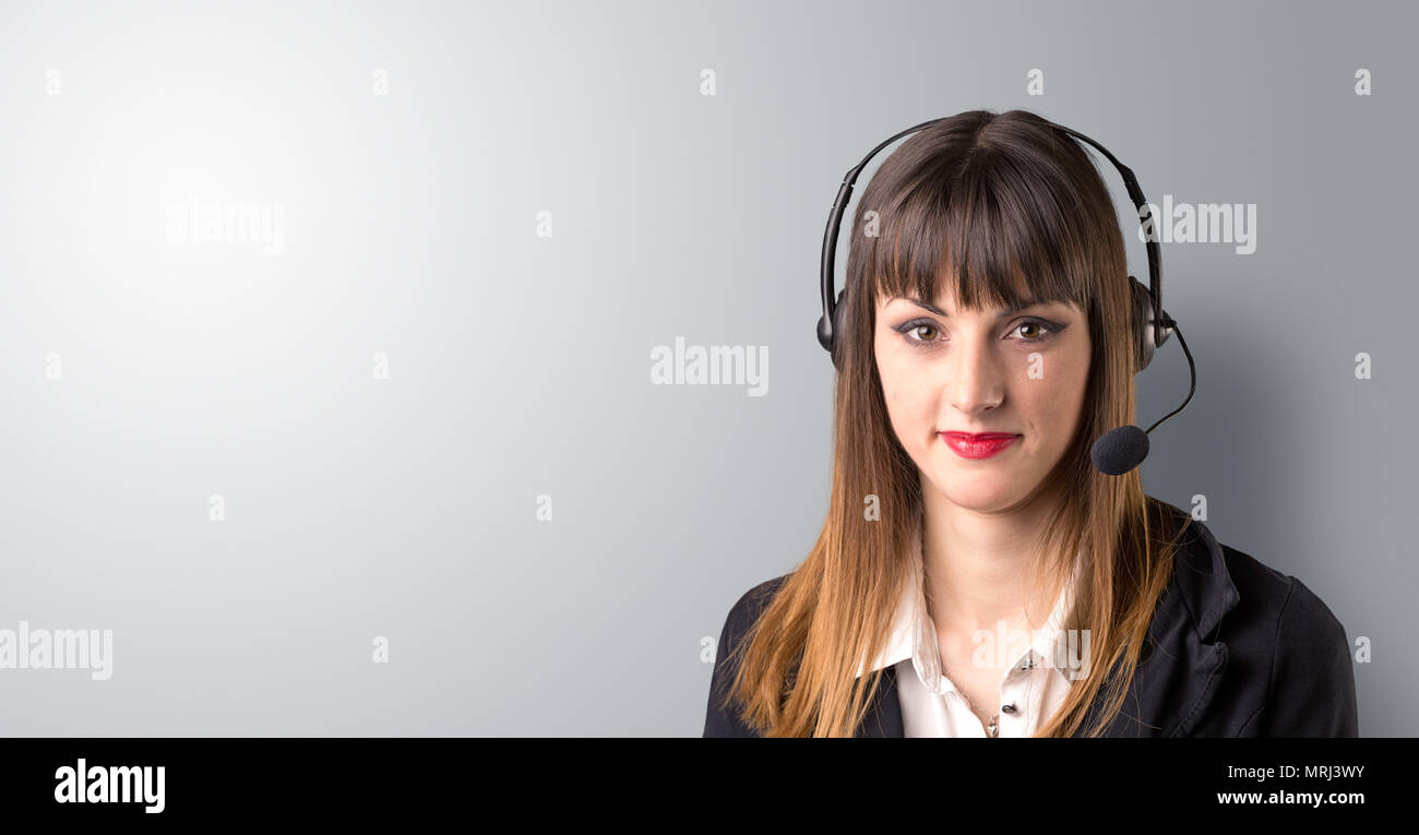 Young female telemarketer on a white background Stock Photo - Alamy