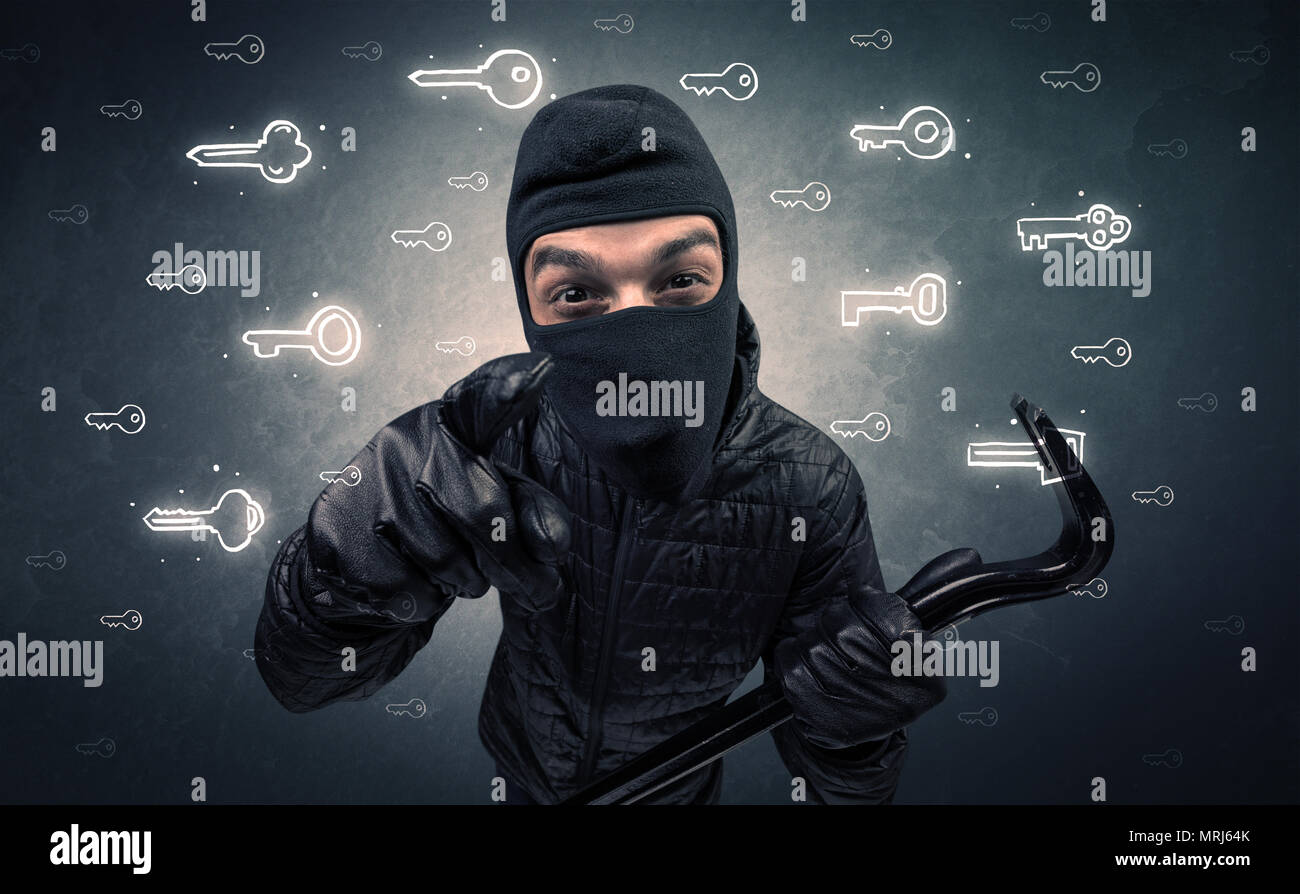 Burglar standing with tools in his hand Stock Photo - Alamy