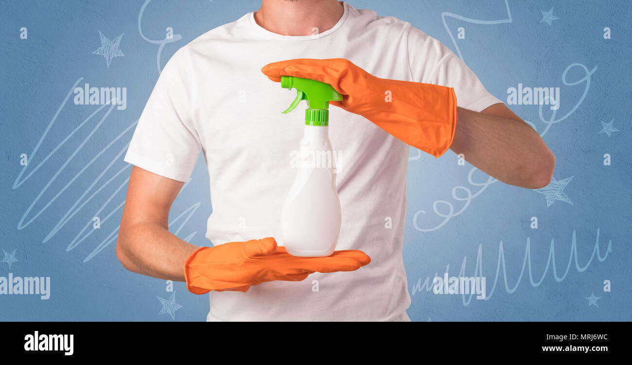 Swabber with orange rubber gloves and doodle concept on wallpaper Stock ...