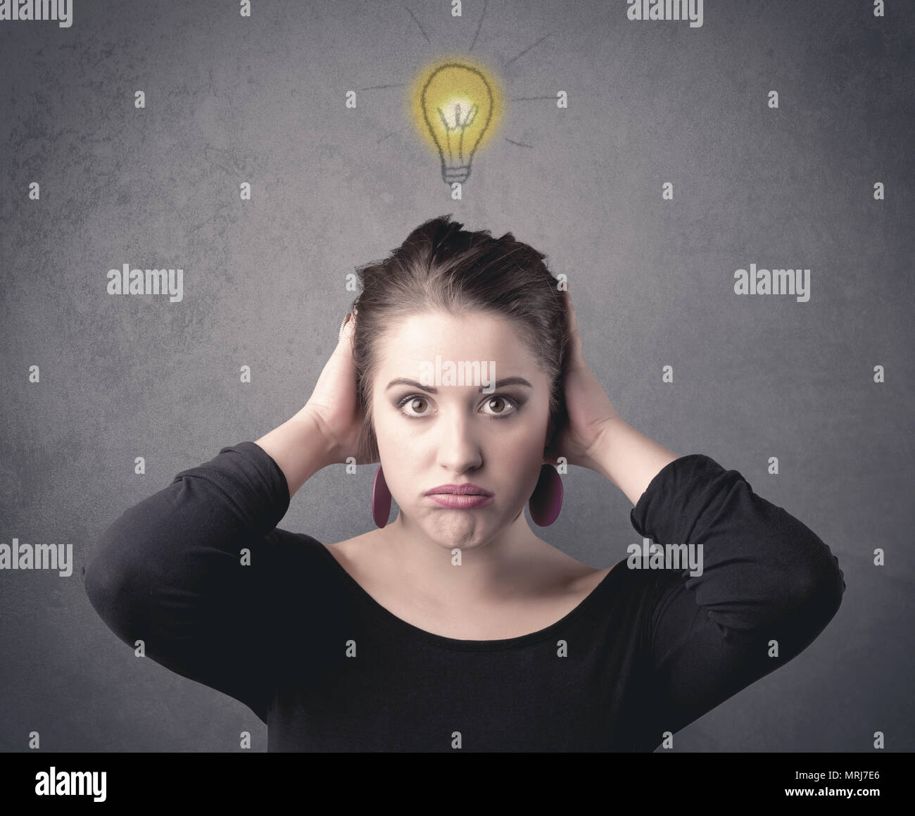 A teen student girl with funny facial expression has a good idea ...