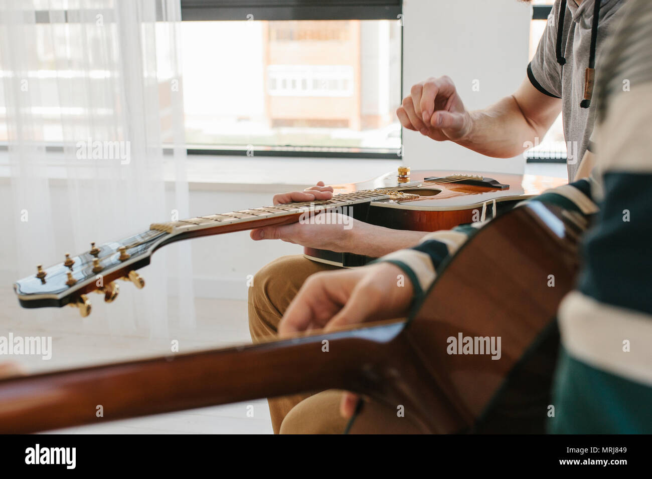 Lifestyle guitarist learning guitar hi-res stock photography and images ...