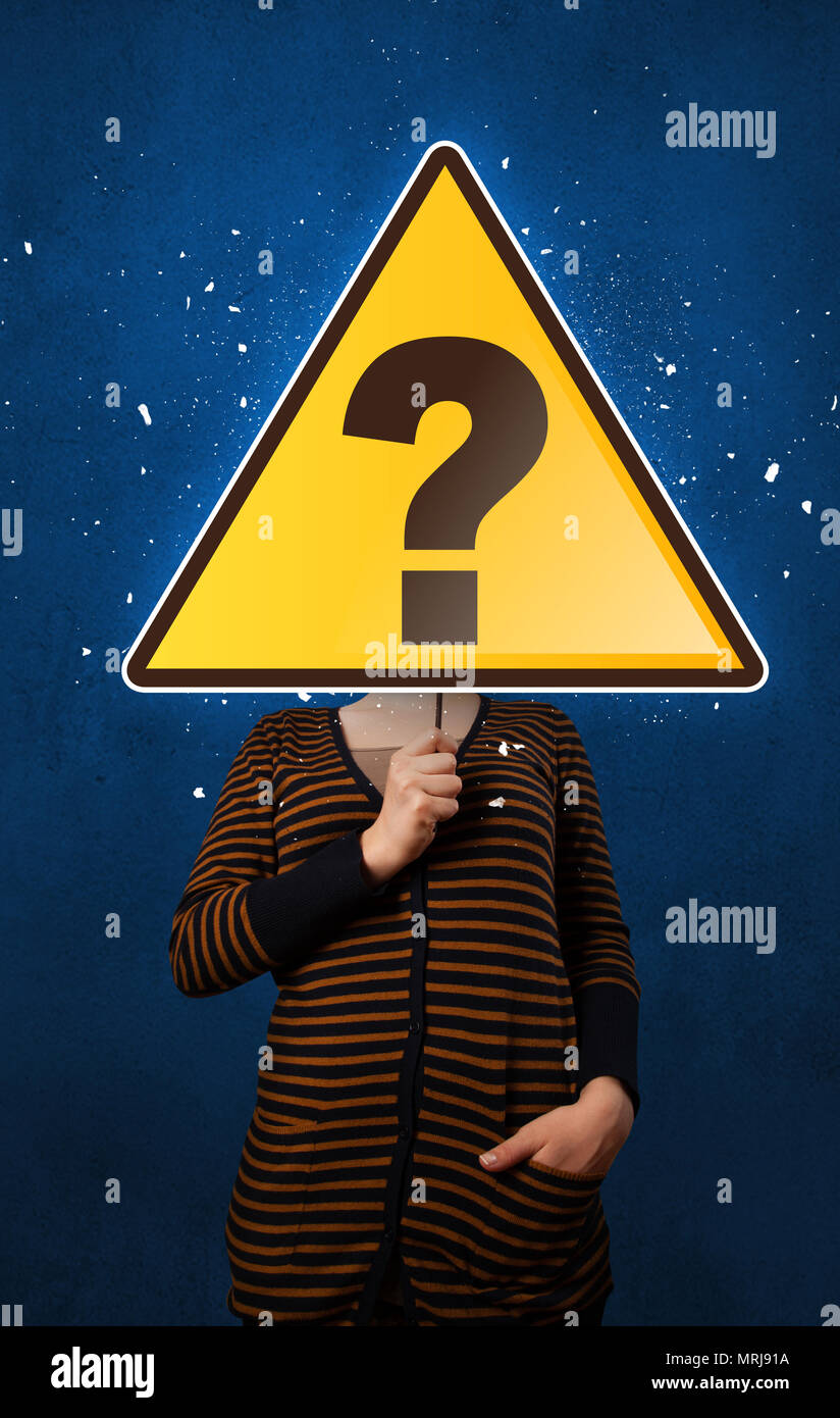 Casual young woman holding yellow sign with question mark Stock Photo ...