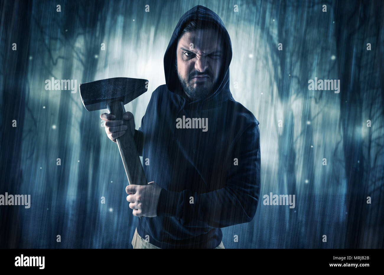 Masked armed hitman in dark thick forest with foggy mysterious concept ...
