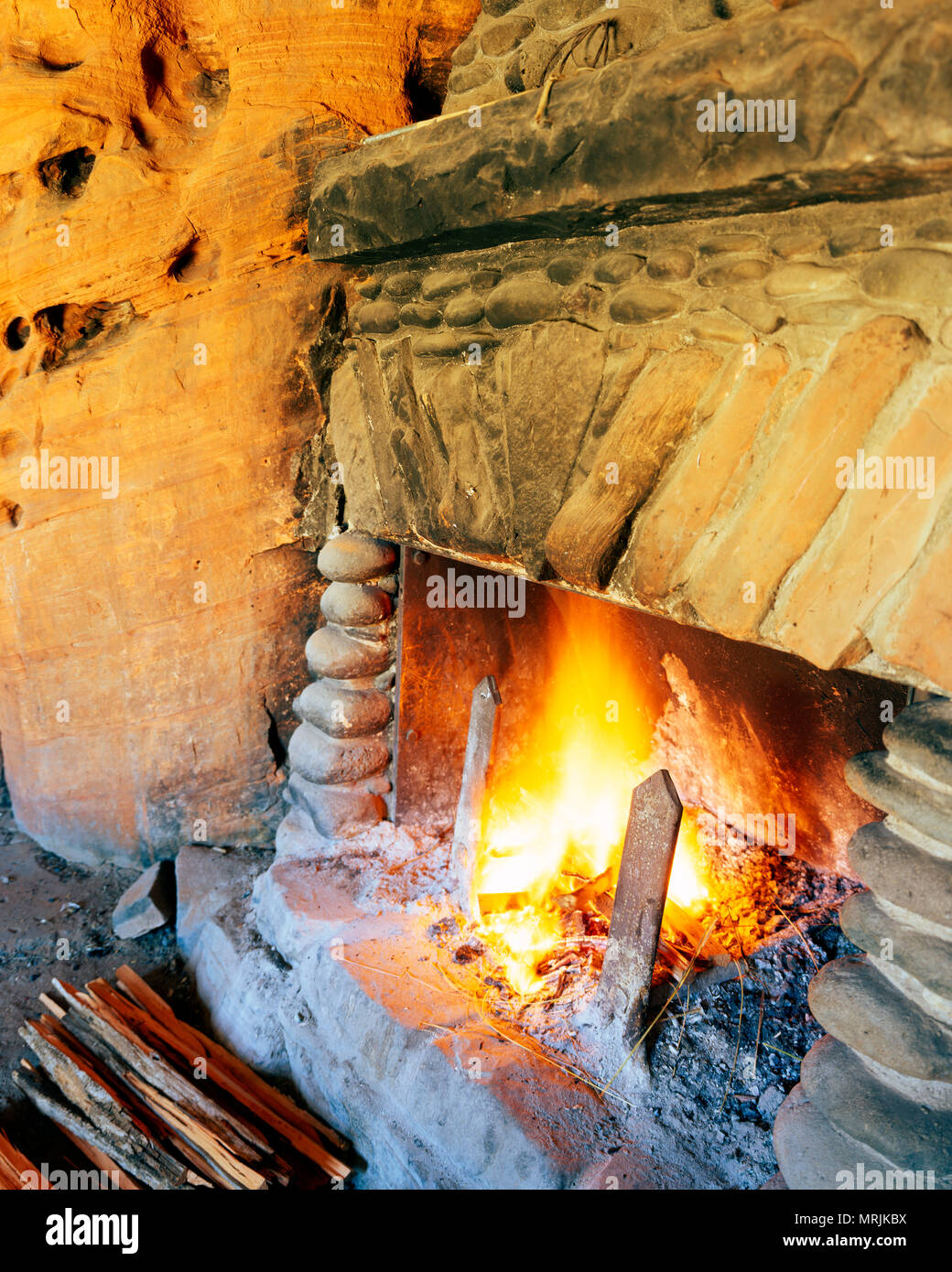 Fire place build into the rock wall in Taylor's cabin in northern ...
