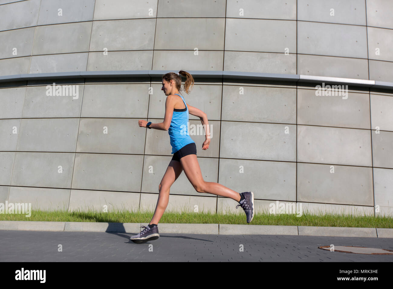 Athlete woman urban runner Stock Photo - Alamy