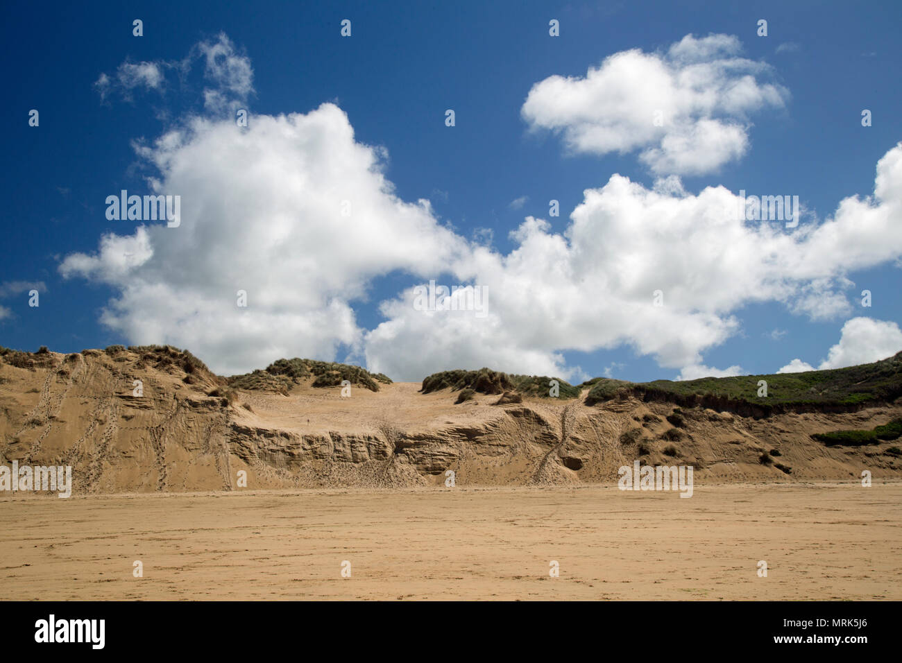 Sand dune cliffs at Harlyn beach, Cornwall, England on a bright sunny ...