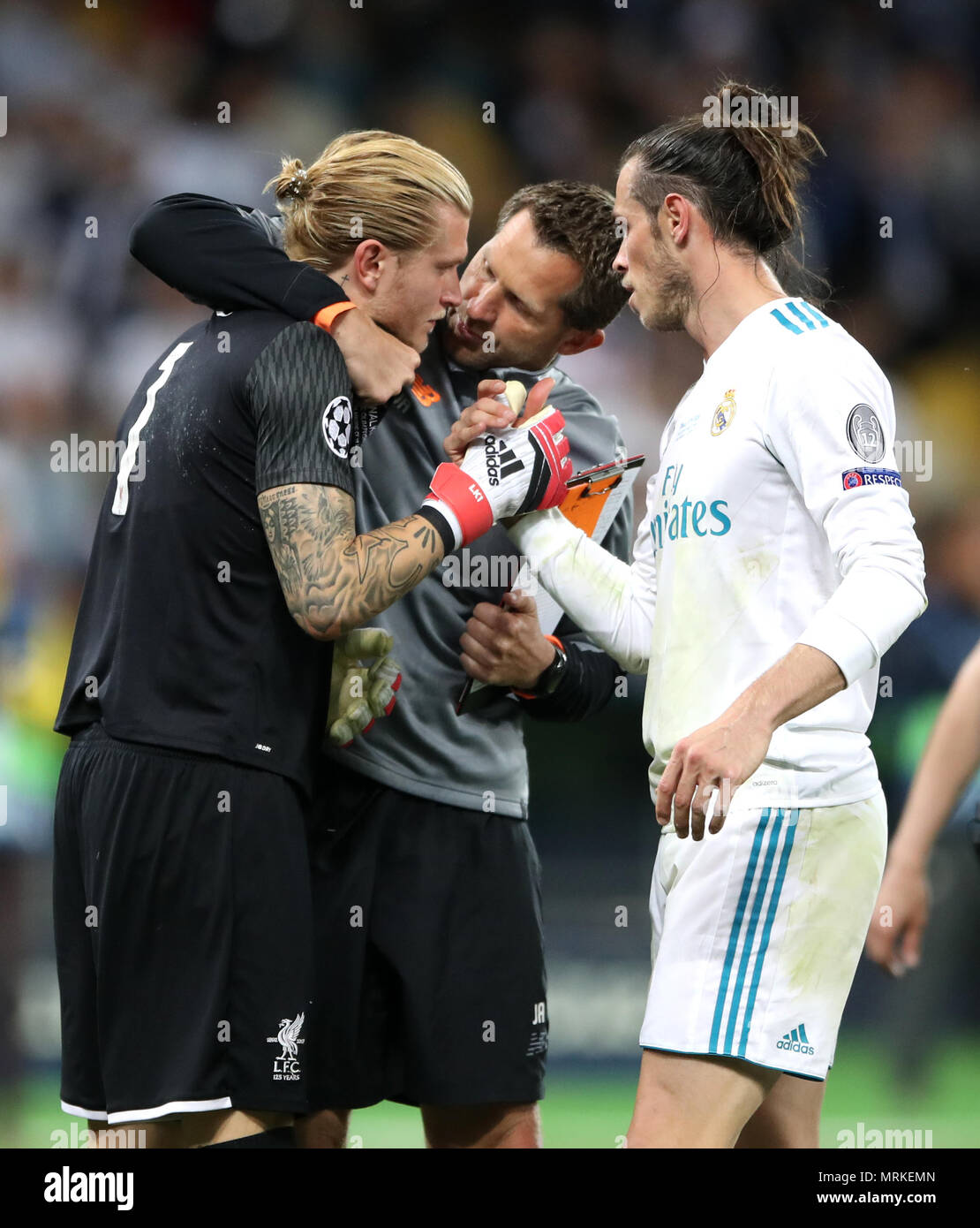 Liverpool goalkeeper Loris Karius is consoled by Liverpool goalkeeping ...