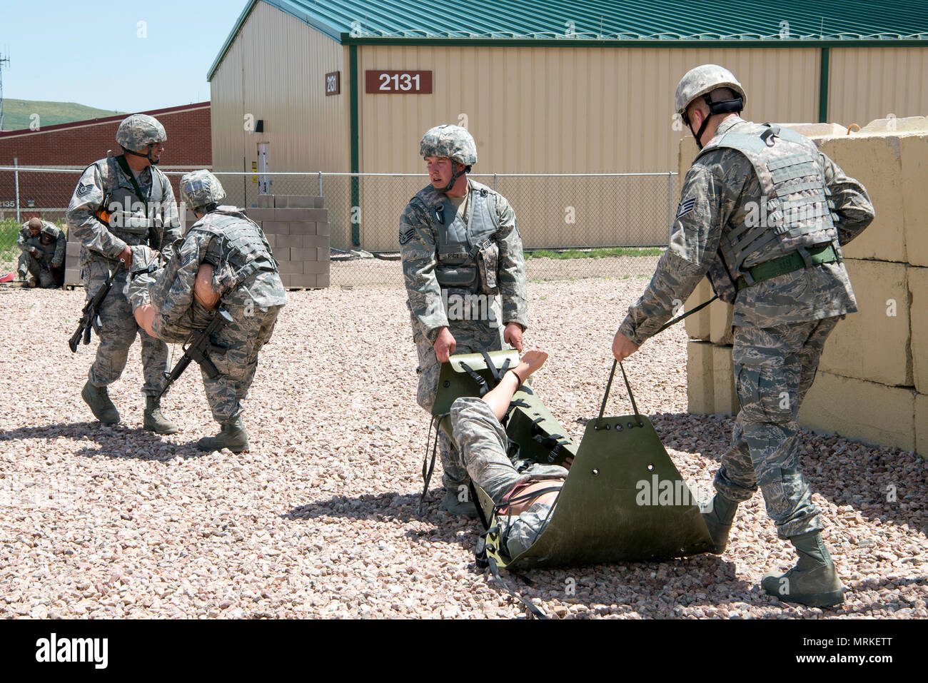Members from the 233d Space Group practice their Self-Aid/Buddy-Care ...