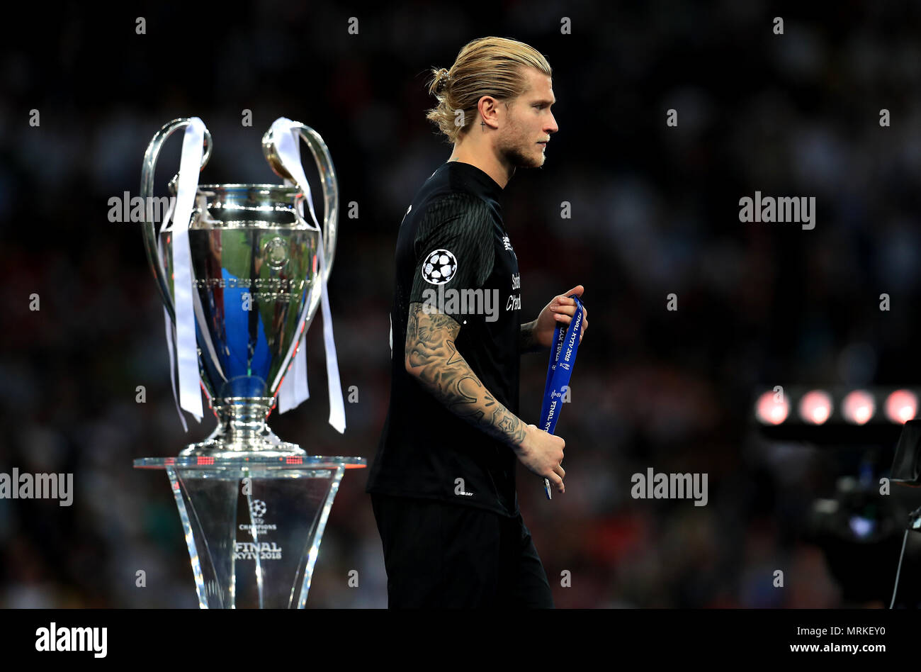 Liverpool goalkeeper Loris Karius walks past the UEFA Champions League ...