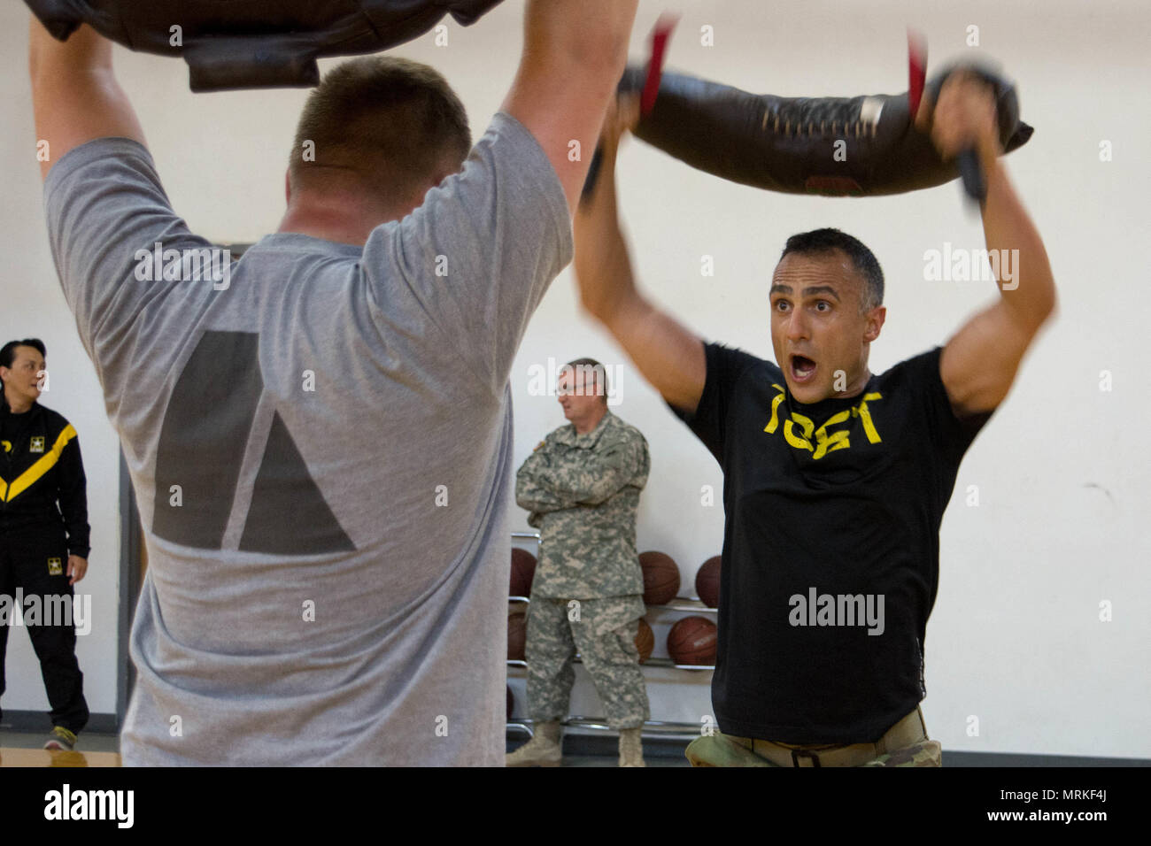 Sgt. Ali Asgary, a Total Soldier Enhancement Training coach, leads U.S ...