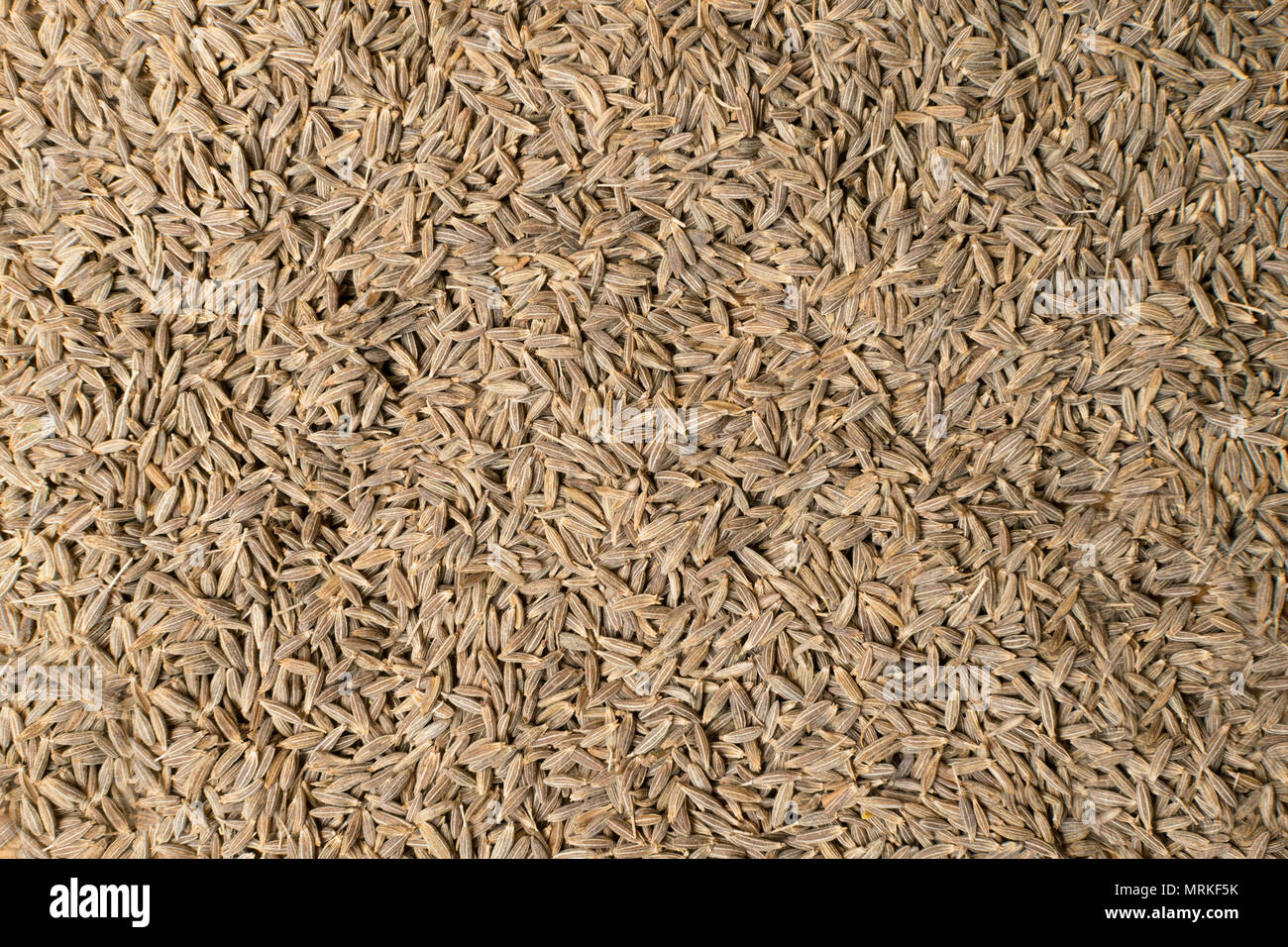 aromatic dried cumin background. Asian spice, condiment Stock Photo - Alamy