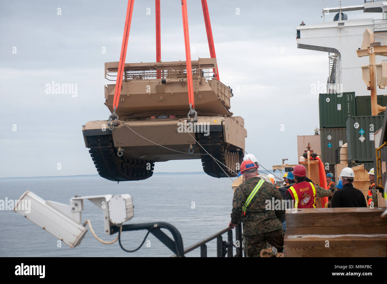 VENTSPILS, Latvia – Navy Cargo Handling Battalion One Sailors lower a ...