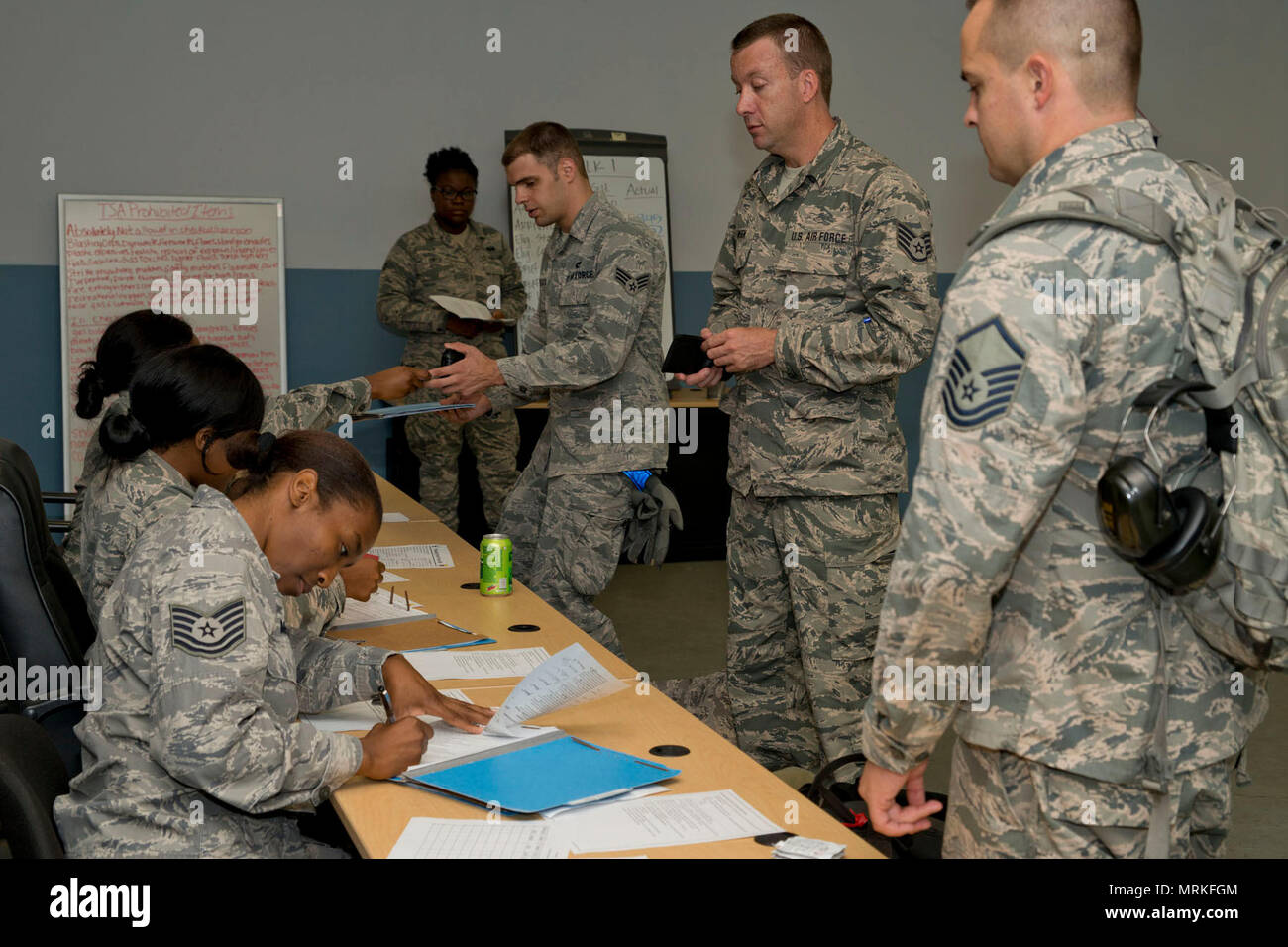 U.S. Air Force Reserve Airmen from the 913th Airlift Group process ...