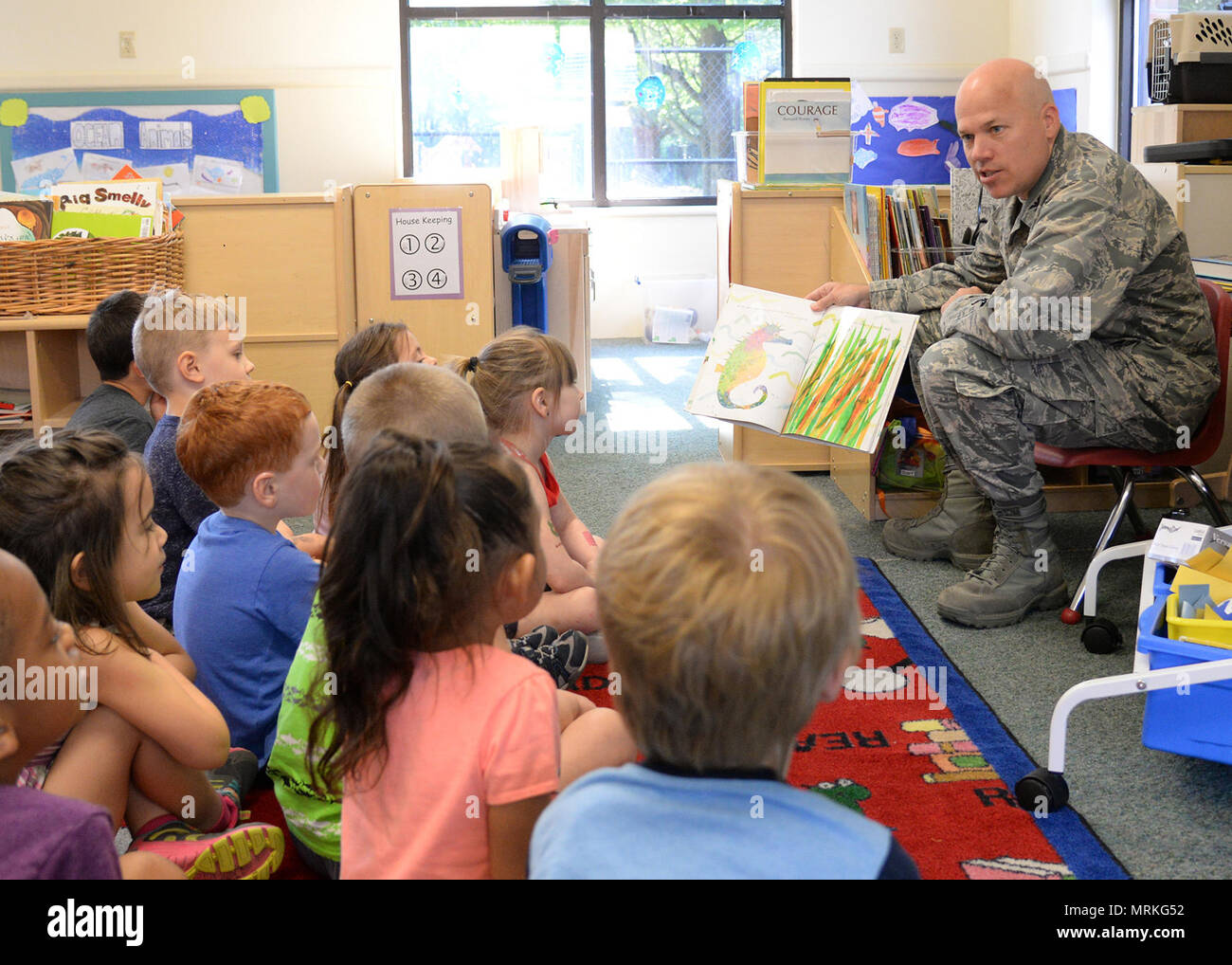 Col. Roman L. Hund (left), installation commander, reads “Mister ...