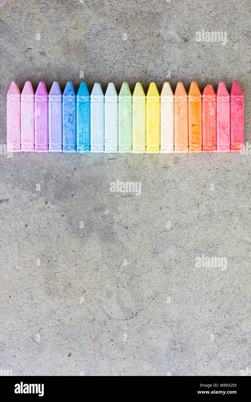 Overhead of lined up multicolored sidewalk chalk Stock Photo - Alamy