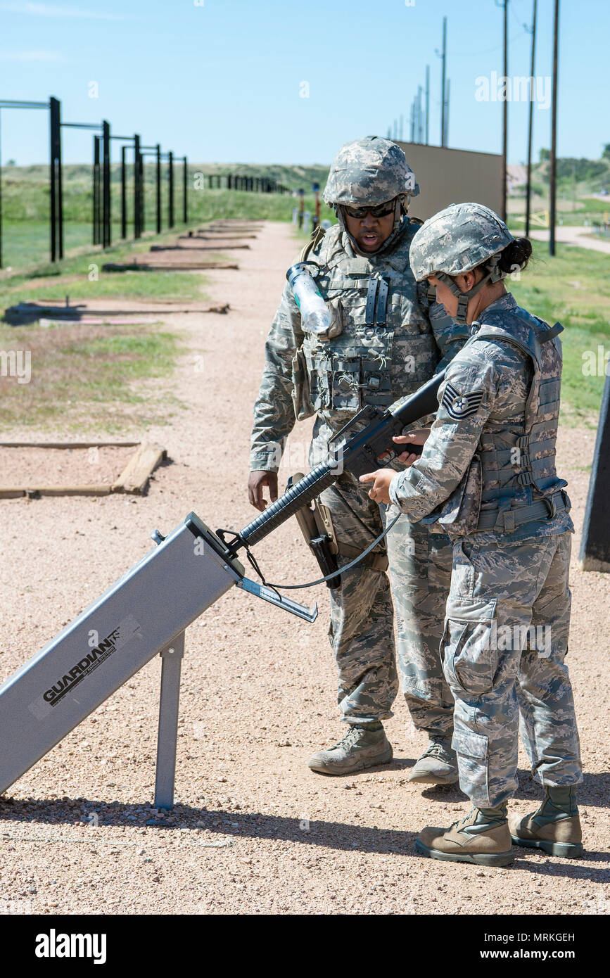 Staff Sgt. Devin Casteel (left), Combat Arms Non-Commissioned Officer ...
