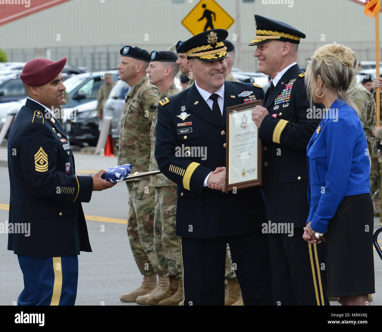 Chief of Staff of the Army General Mark A. Milley, center, presents the ...
