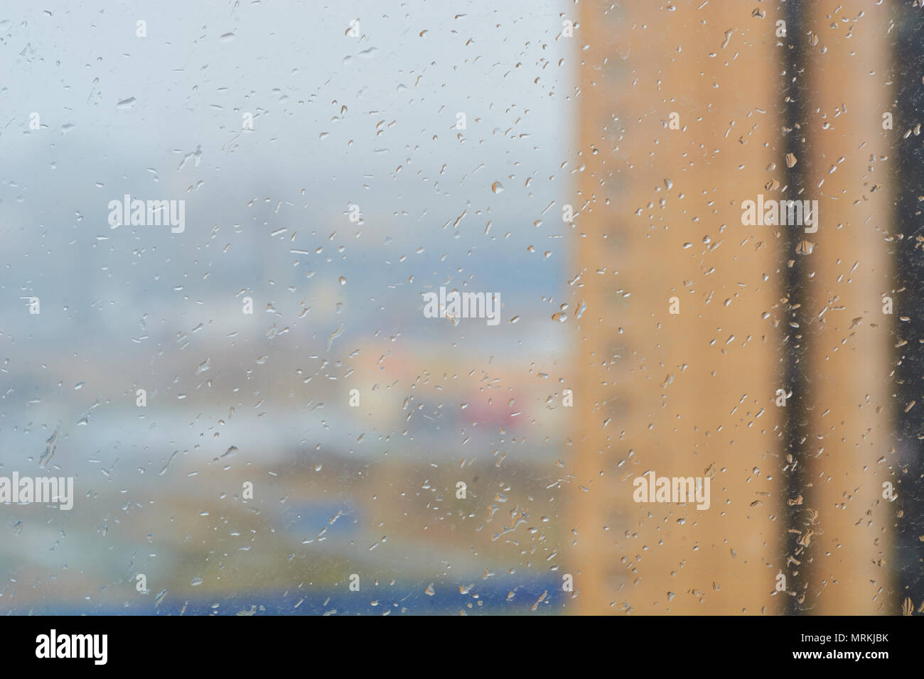 rain drops on glass Windows in the city Stock Photo - Alamy