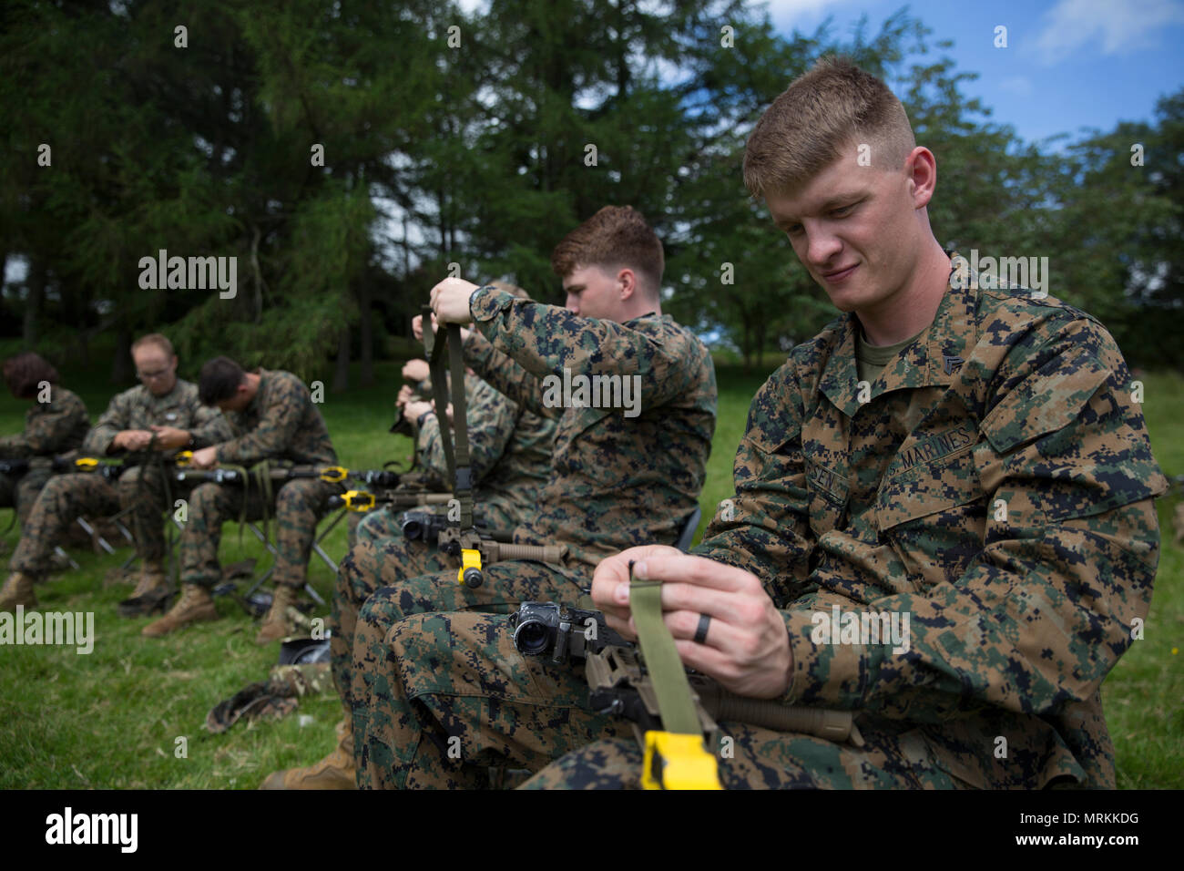 U.S. Marines complete the assembly of SA80 Assault Rifles as part of a ...