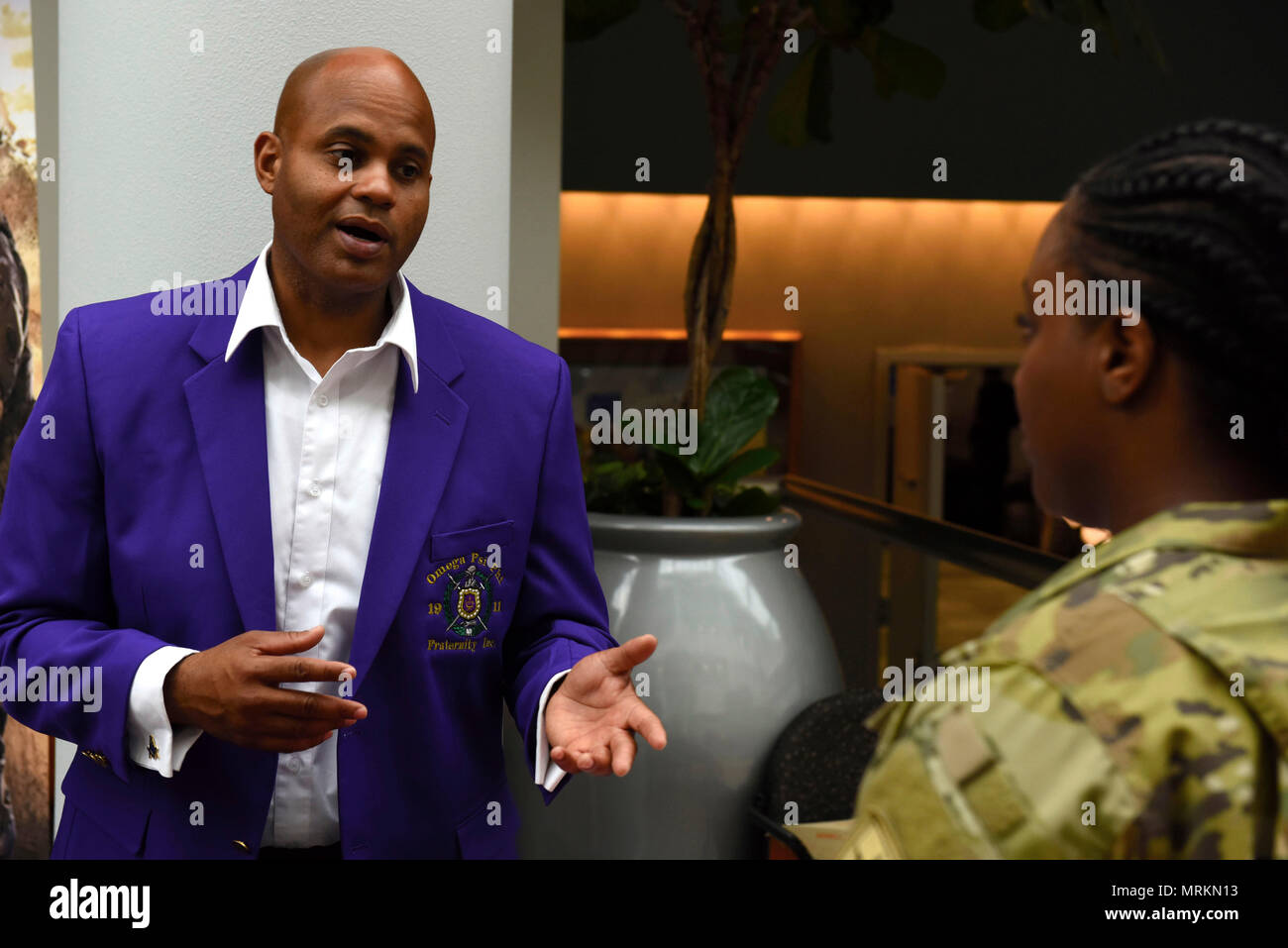 A representative of the Omega Psi Phi Fraternity speaks to an Army ...