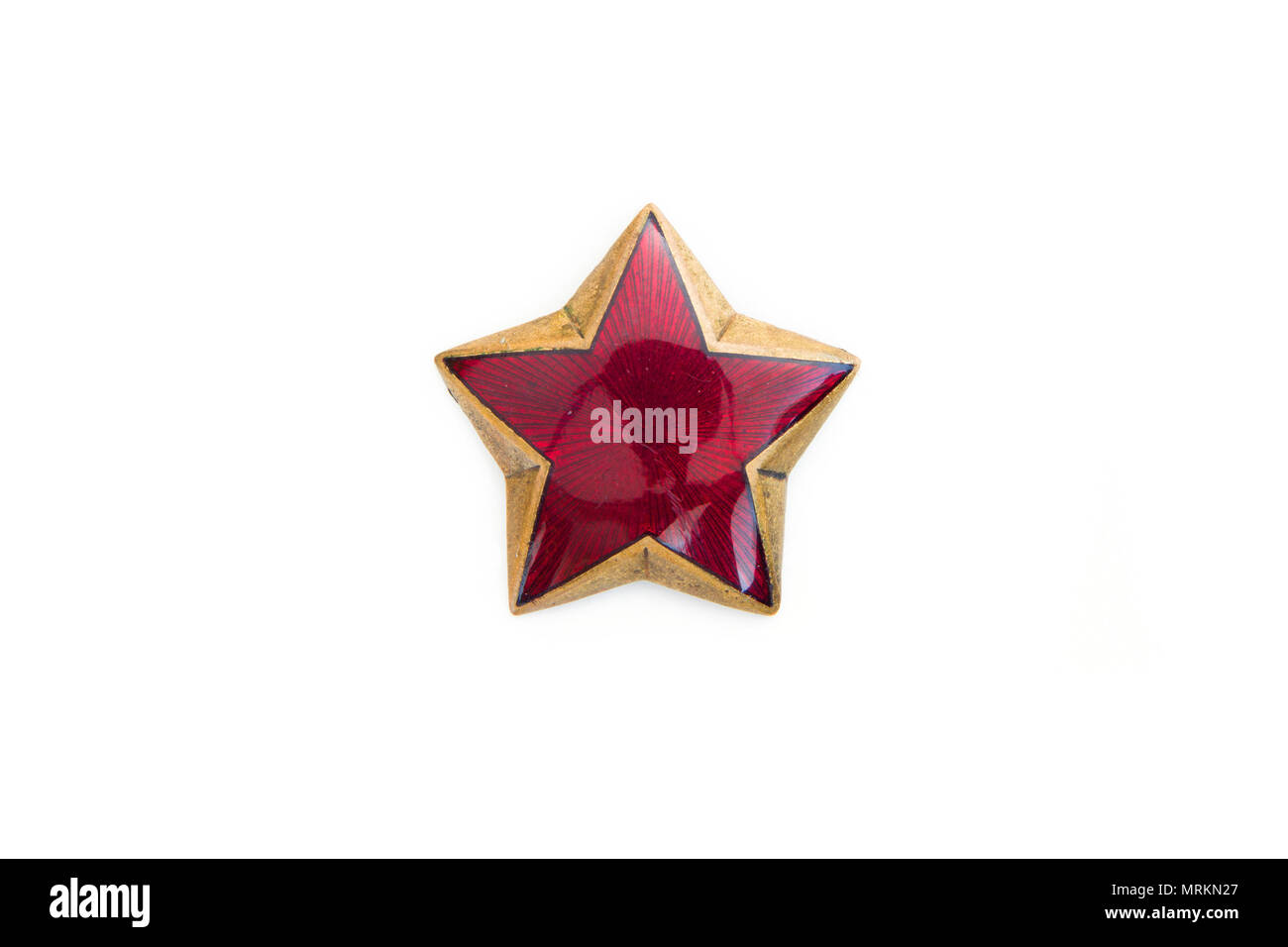 Old red star from communist military cap isolated on the white ...