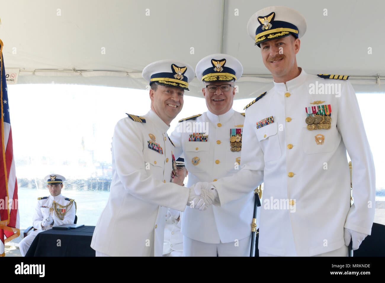 Capt. Jason Hamilton (left), former commanding officer of the Coast ...