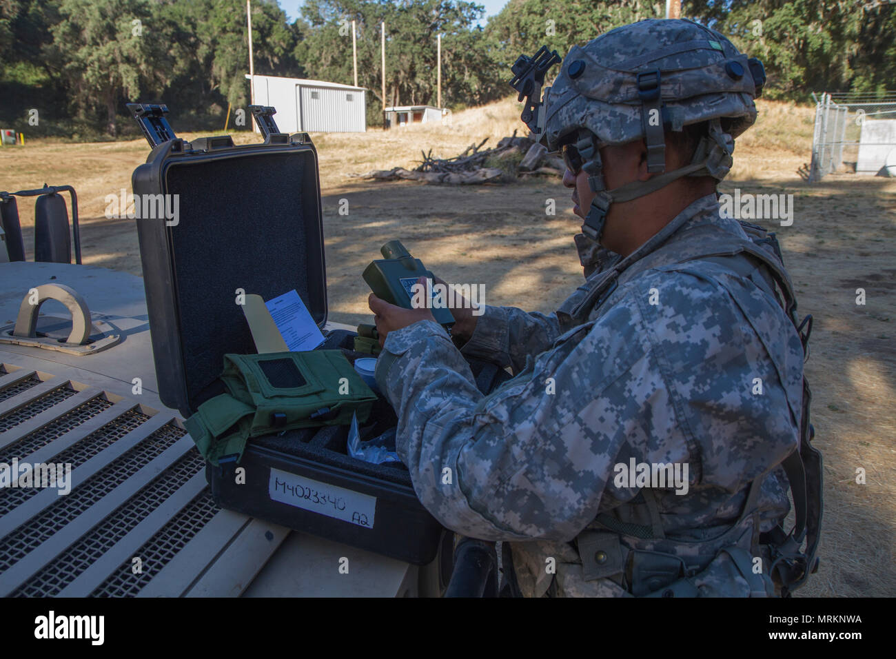 U.S. Army Spc. Justin Farfan assembles a Joint Chemical Agent Detector ...