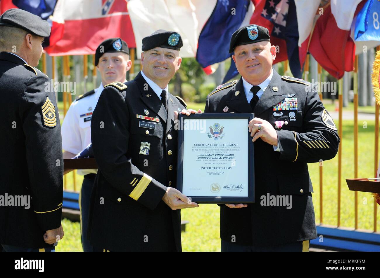Sgt. 1st Class Christopher A. Prater (right) receives his retirement ...