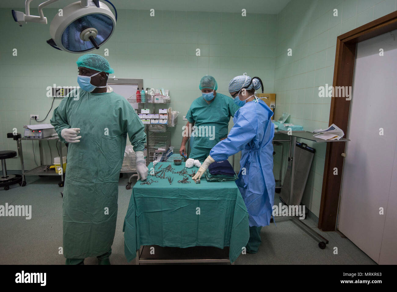 U.S. Army Maj. Christina Riojas (right), general surgeon, shows Col ...