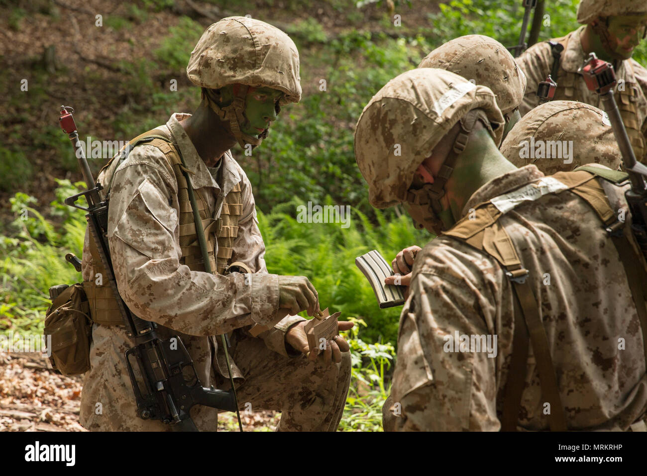 U.S. Marine Candidates participate in a fire team assault course at the ...
