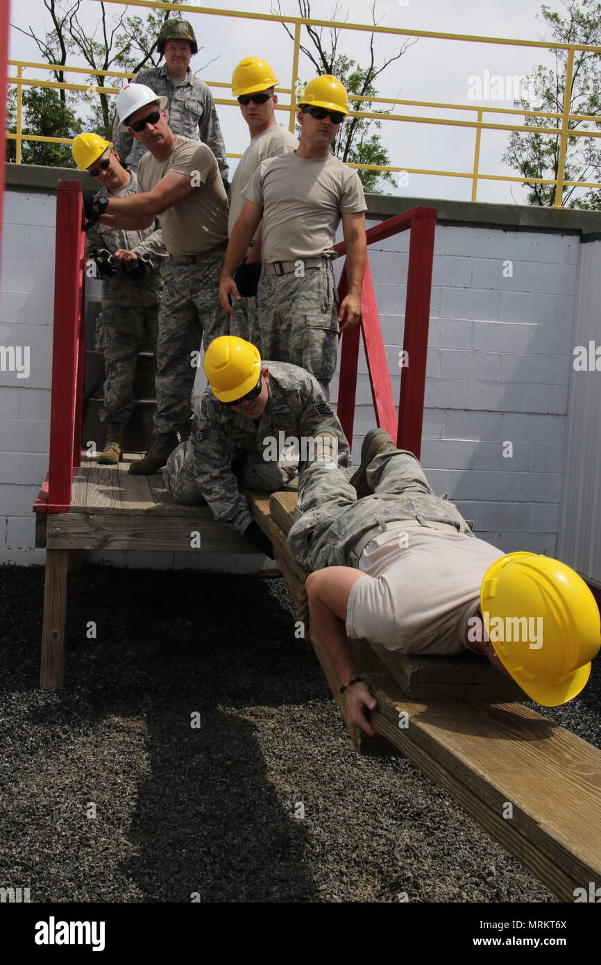 Airmen of the 211th Engineering Installation Squadron work on team ...