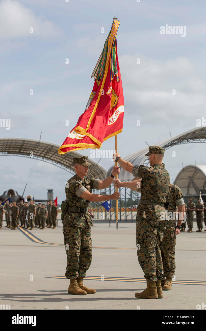 U.S Marine Corps Lt. Col. Gregory Summa, right, relinquishes the colors ...