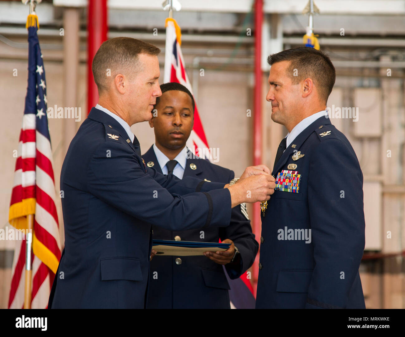 Col. Kevin Gordon, 15th Wing commander, presents Col. Charles Velino ...