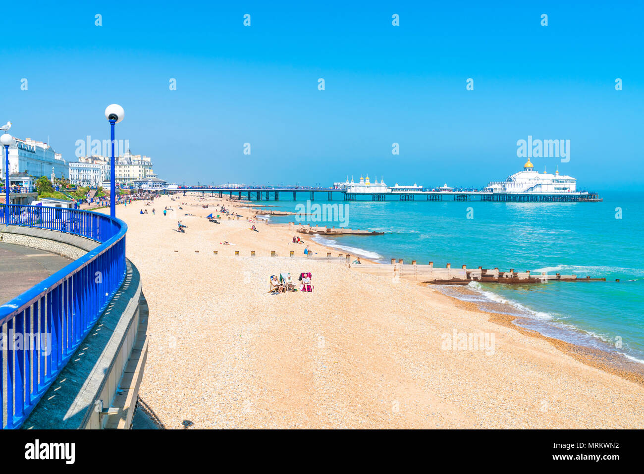 EASTBOURNE, SUSSEX, UK - MAY 20,2018: People relax on the beach in ...