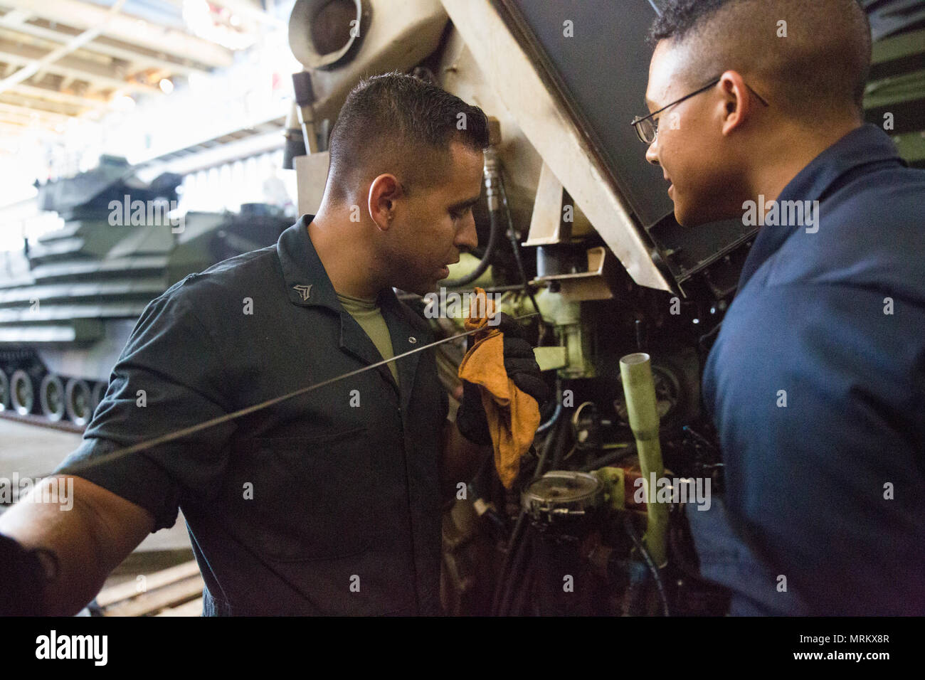 Combat Cargo Marines with Combat Logistics Battalion 31 chain a tractor ...