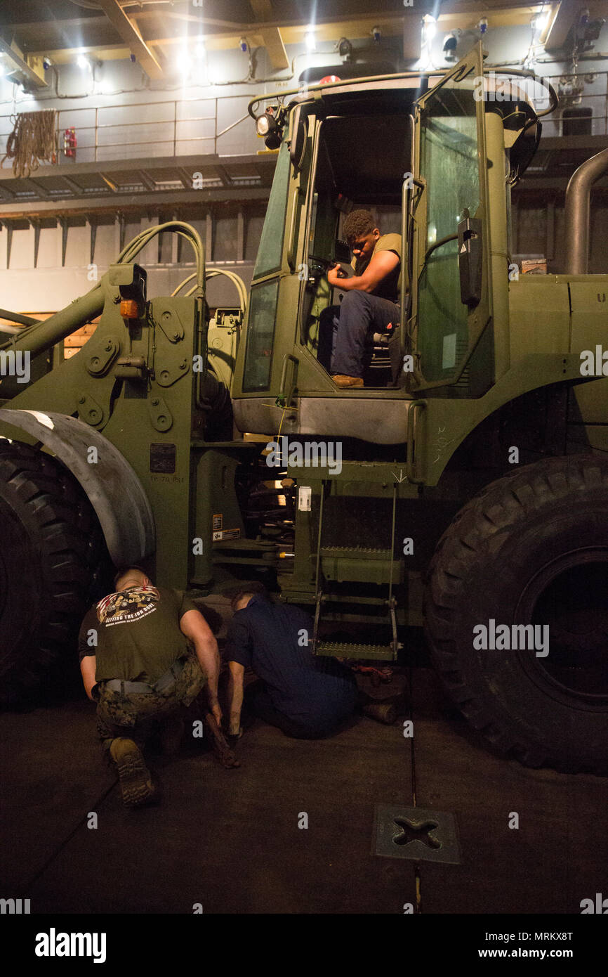 Combat Cargo Marines with Combat Logistics Battalion 31 chain a tractor ...