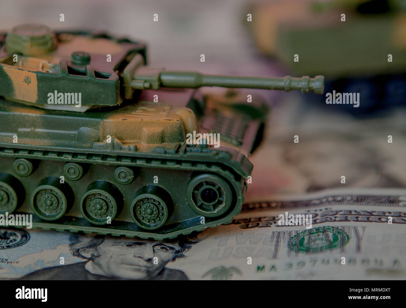 tank against the background of dollars. Concept of war Stock Photo - Alamy